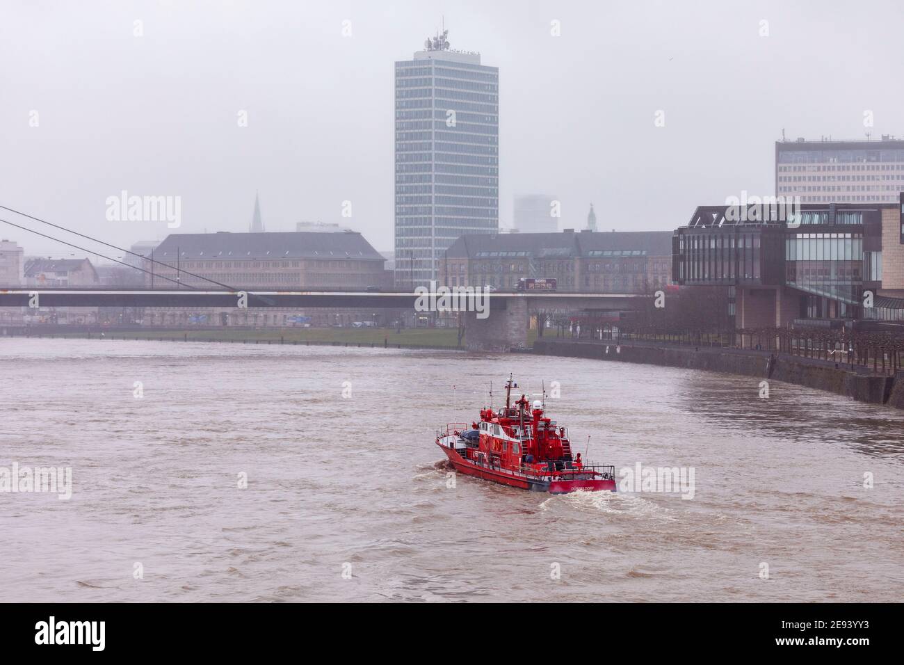 Flood on the Rhine in Dusseldorf - fire boat during a patrol towards ...