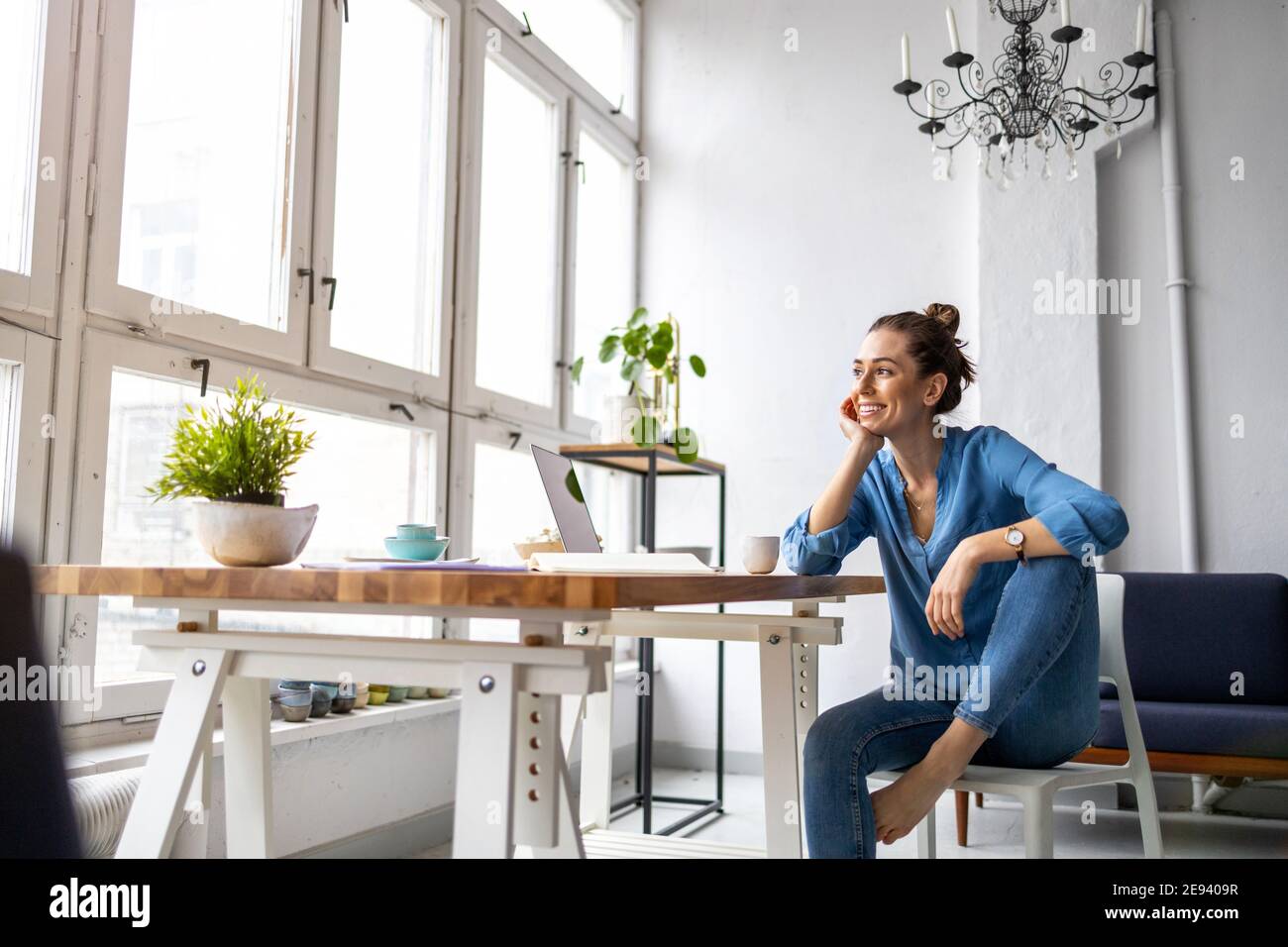 Portrait of a smiling creative woman in a modern loft space Stock Photo ...