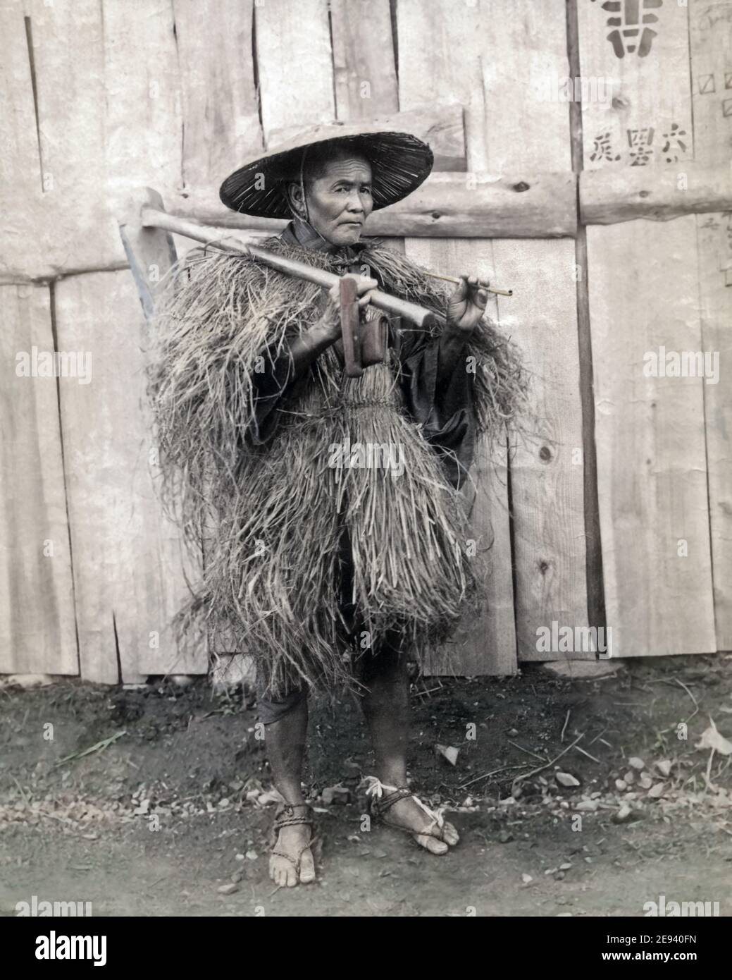 Late 19th century photograph - Farmer, farm worker in grass coat, Japan ...