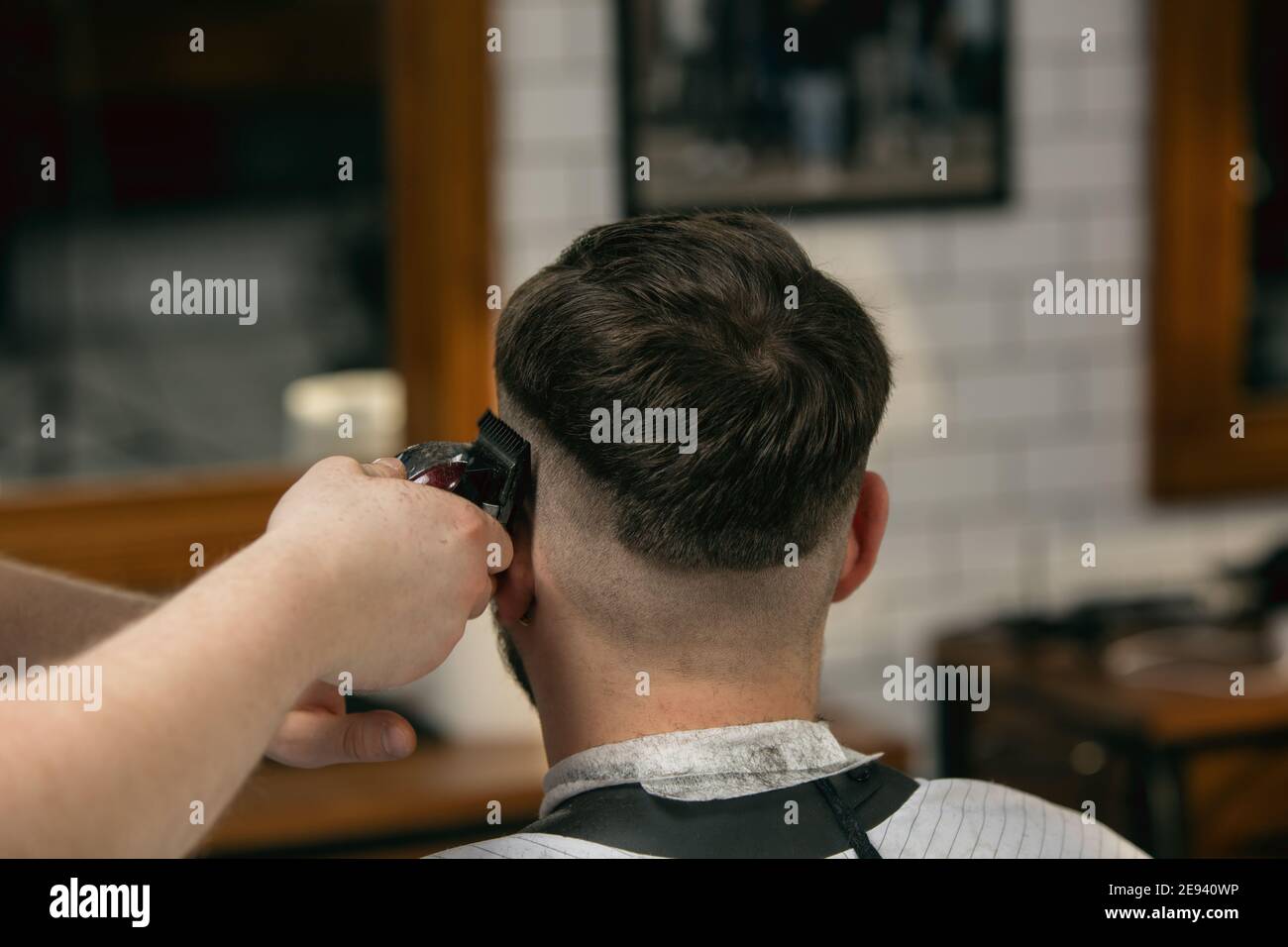 Fresh style. Close up of client of master barber, stylist during ...