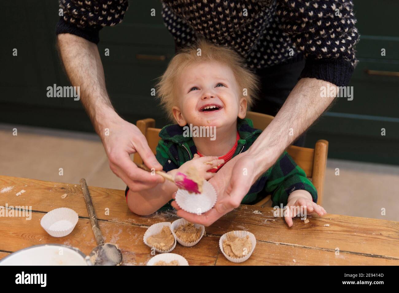 Helping bake hi-res stock photography and images - Alamy