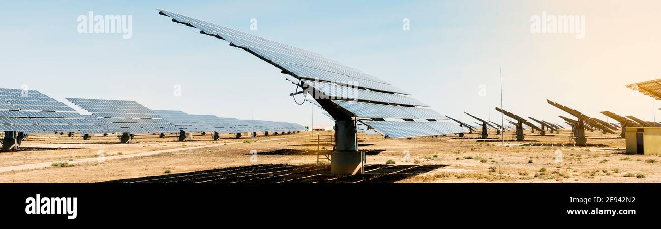 a view of some solar panels in a solar power plant in a desert ...