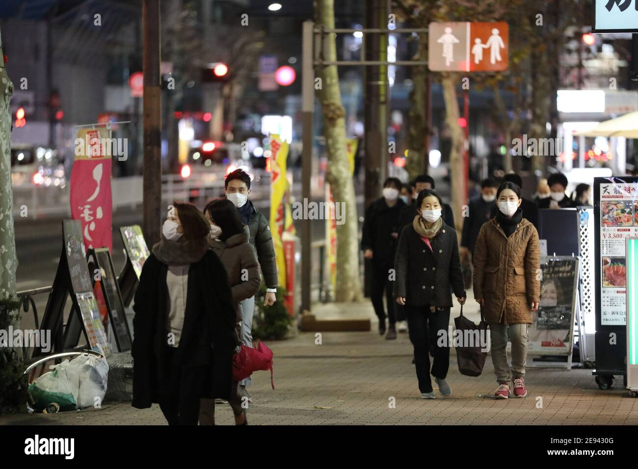 Tokyo, Japan. 2nd Feb, 2021. People wearing face masks walk on a street ...