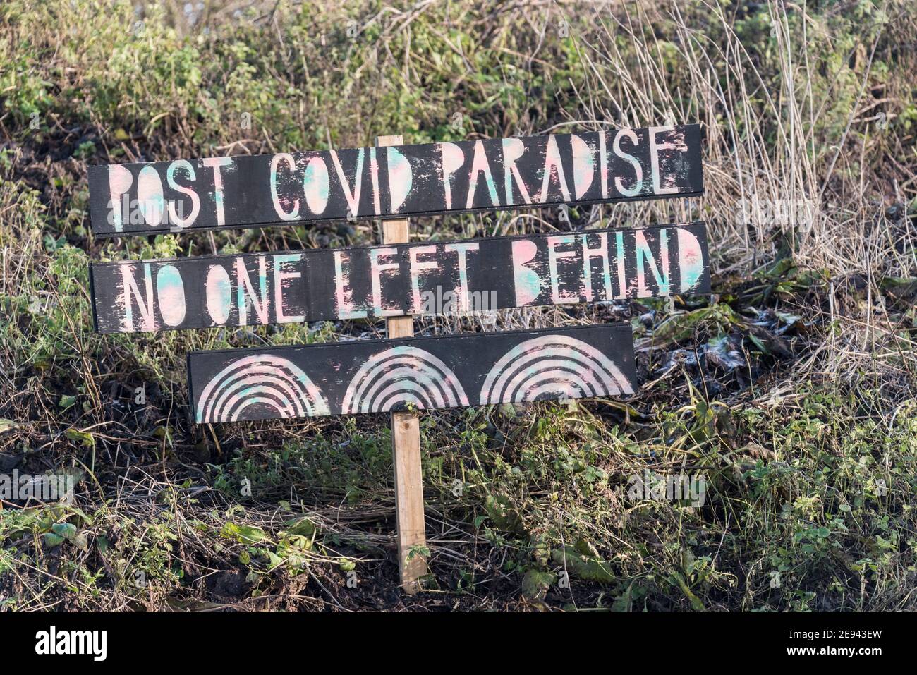 Riverside sign sayin "Post Covid Paradise - No One Left Behind Stock ...