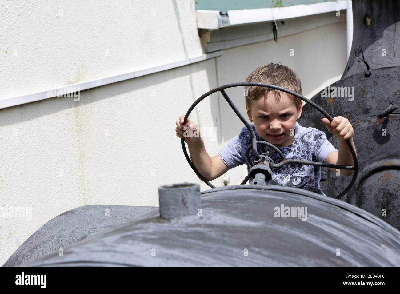 Child driving an old tractor in the museum Stock Photo - Alamy