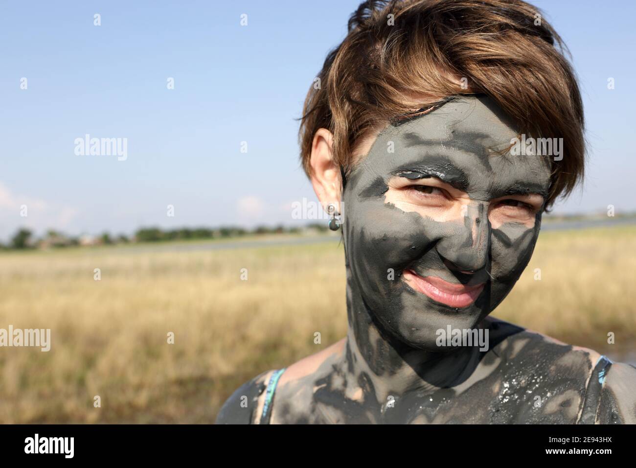 Portrait of a woman with mud face Stock Photo - Alamy