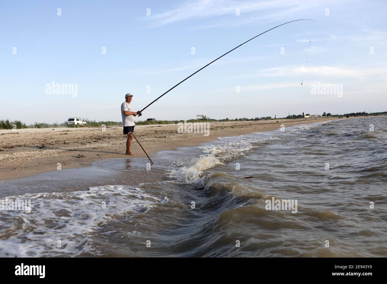 Senior man fishing on the Sea of Azov Stock Photo - Alamy