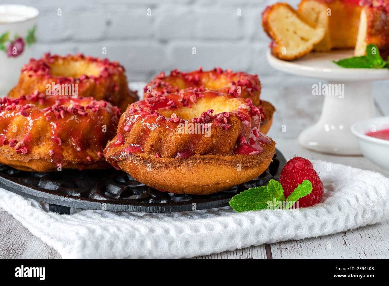 Mini vanilla pound cakes with raspberry icing Stock Photo - Alamy