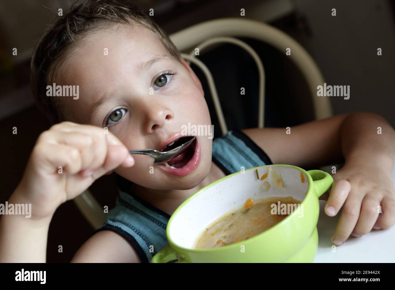 The pensive boy eating soup at home Stock Photo - Alamy