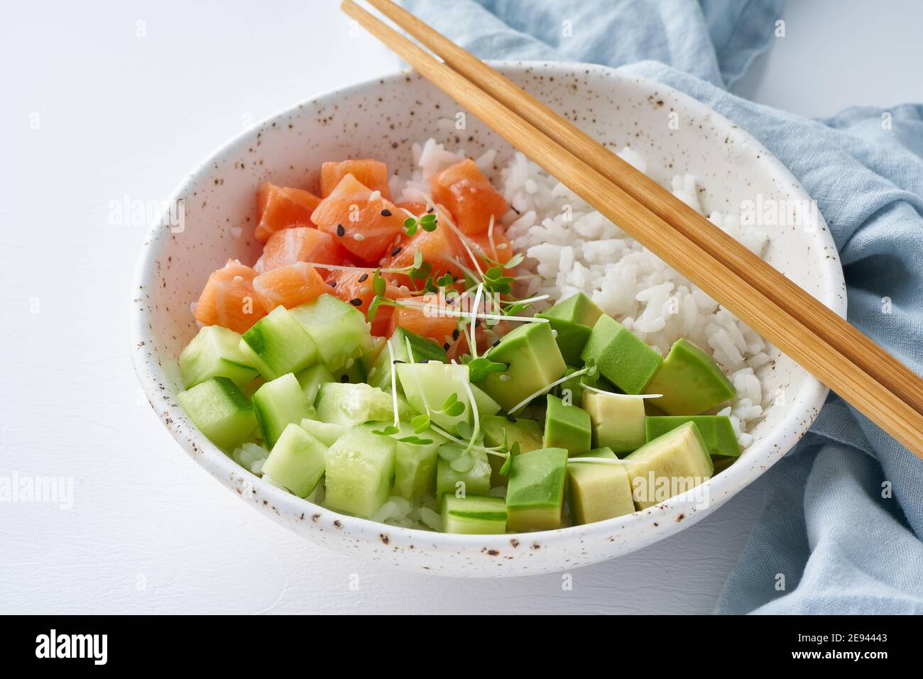 salmon poke bowl with fresh fish, rice, cucumber, avocado Stock Photo ...