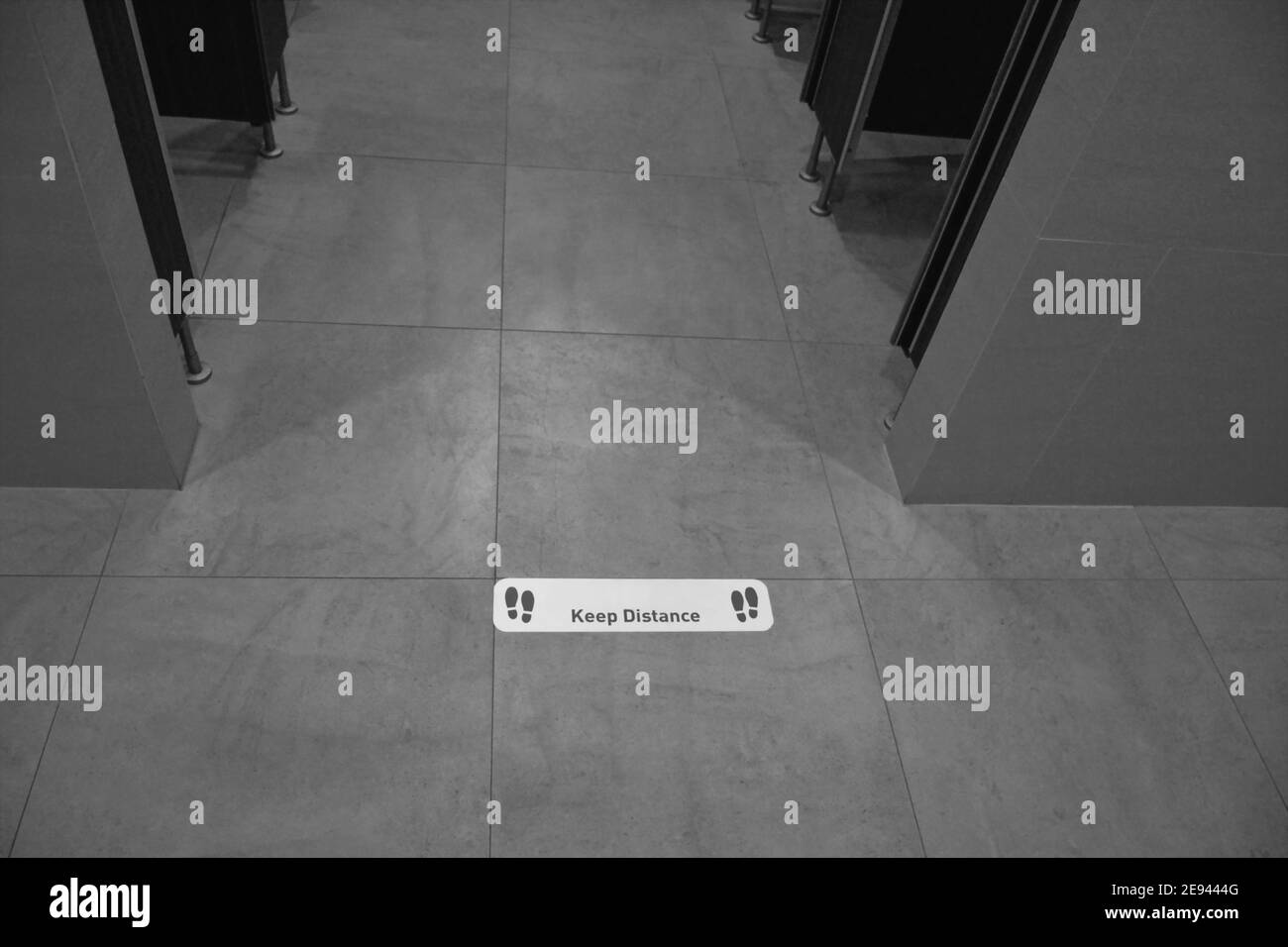 white sticker sign for social or physical distancing in coronavirus ...