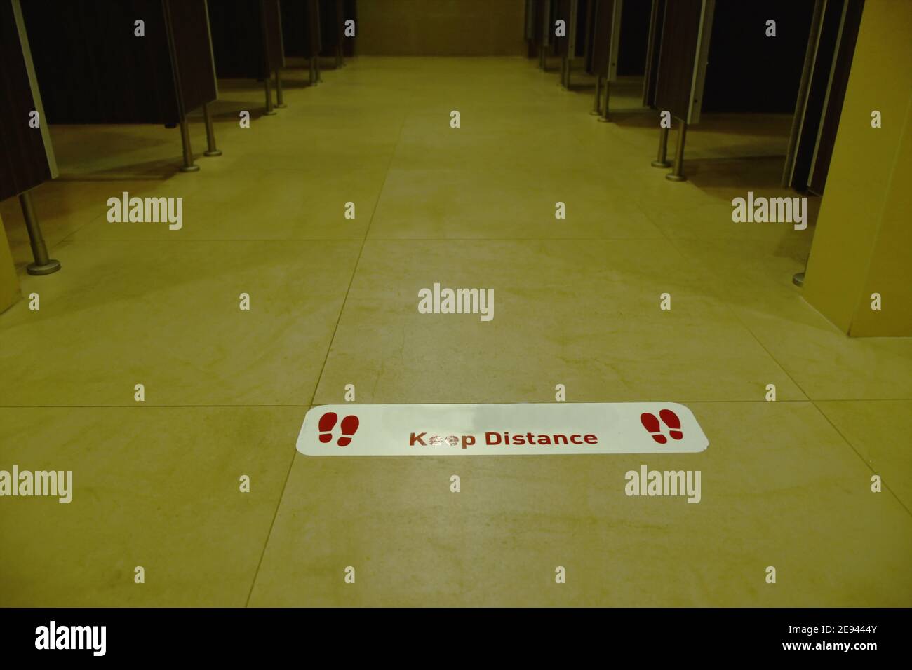 white sticker sign for social or physical distancing in coronavirus ...