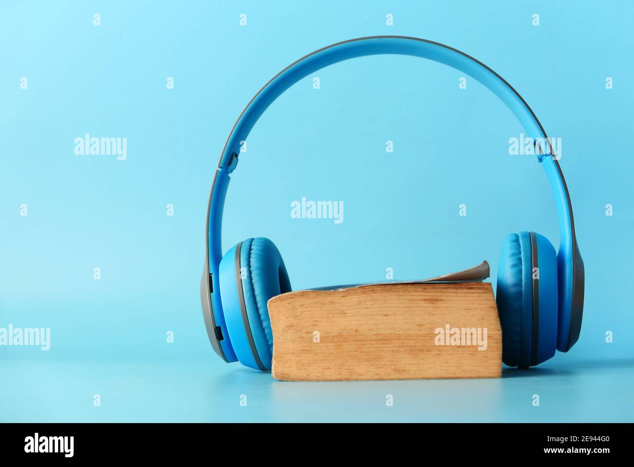 Audio book concept. Headphones and notepad on white background Stock ...