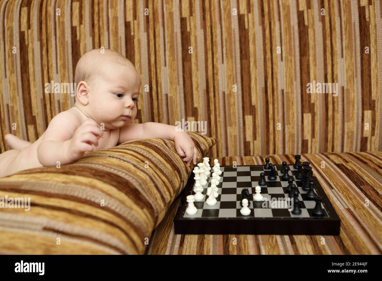 Baby playing chess hi-res stock photography and images - Alamy