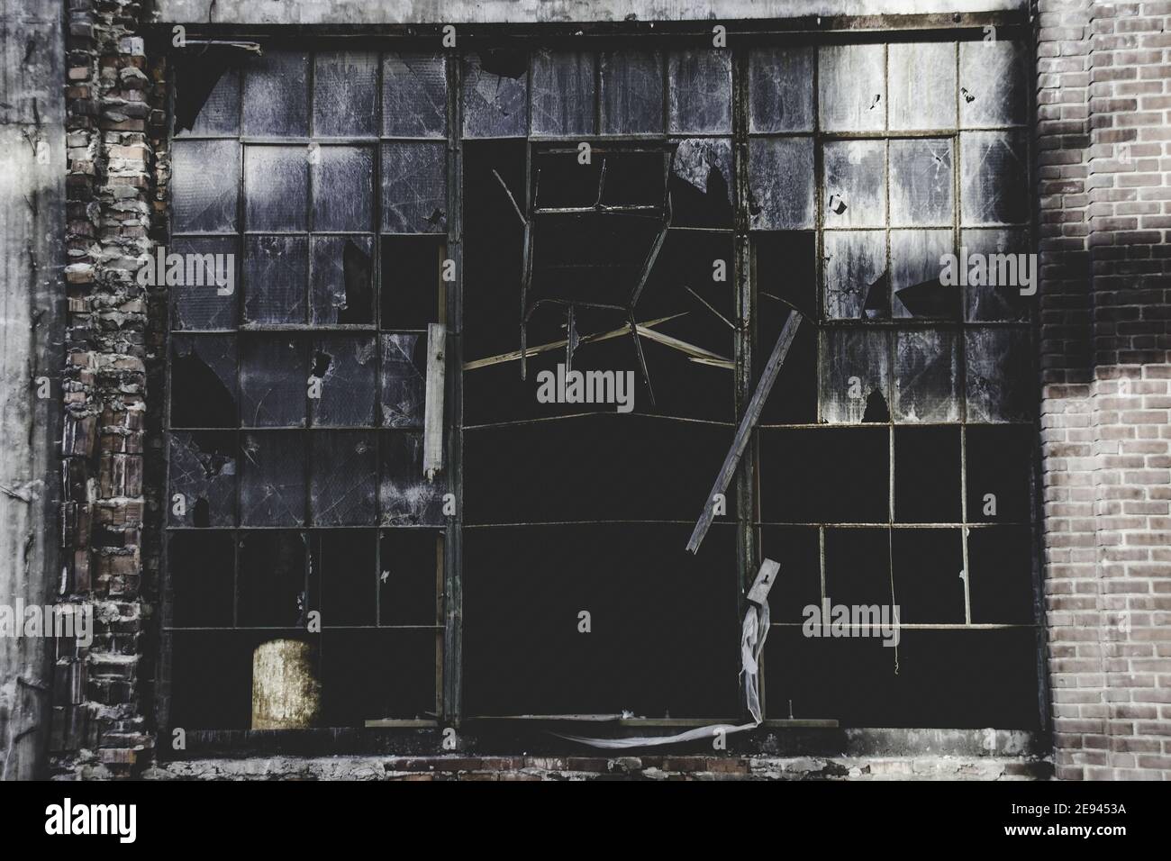 Broken window of an abandoned building Stock Photo - Alamy