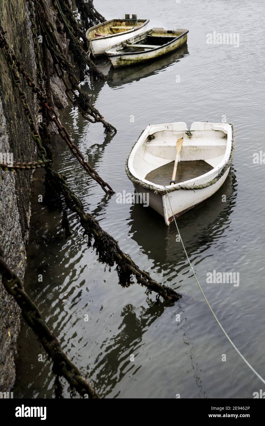 Vertical shot of old rusty boats in a port Stock Photo - Alamy