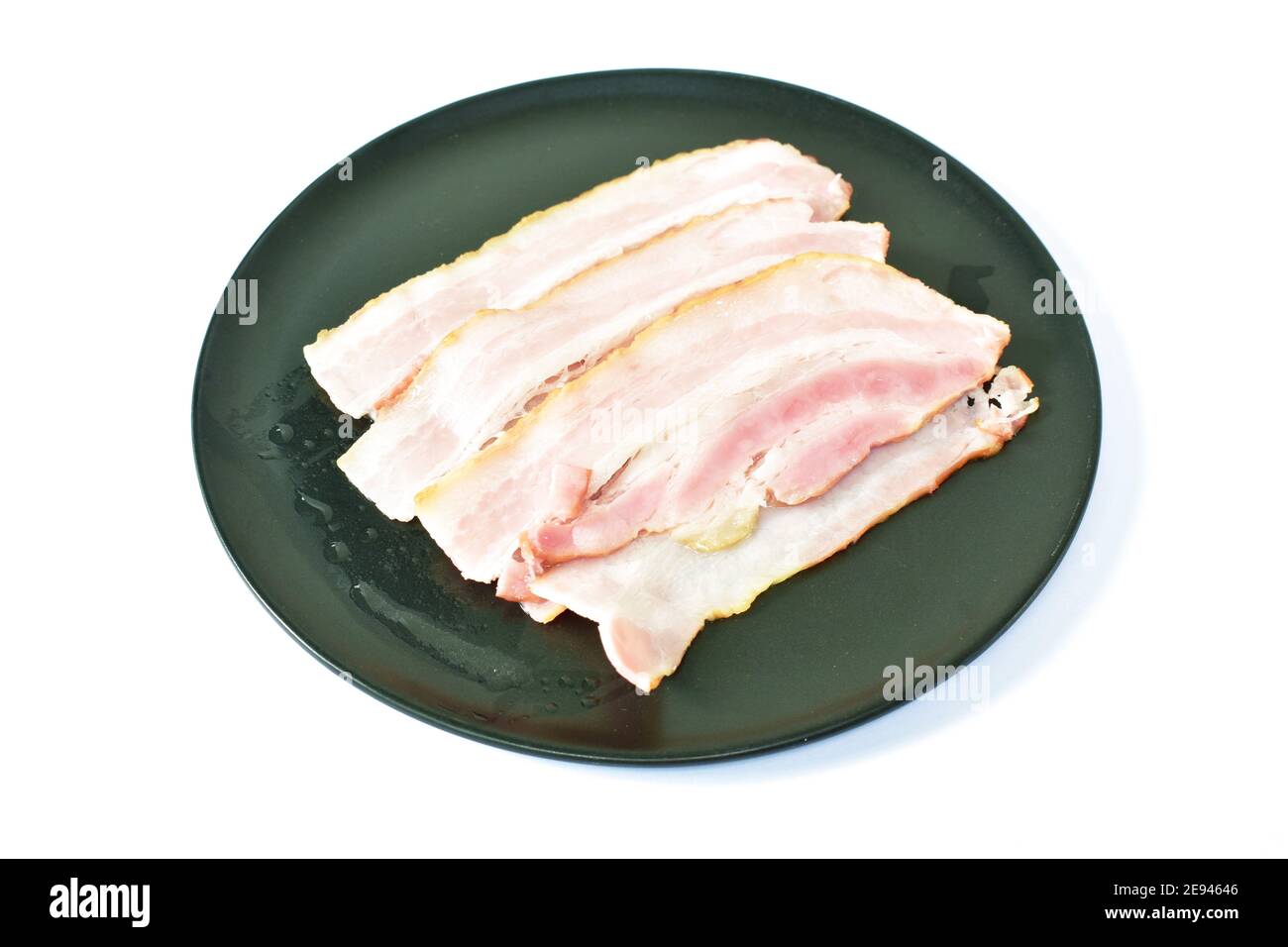 steamed slice pork bacon arranging on plate in white background Stock ...