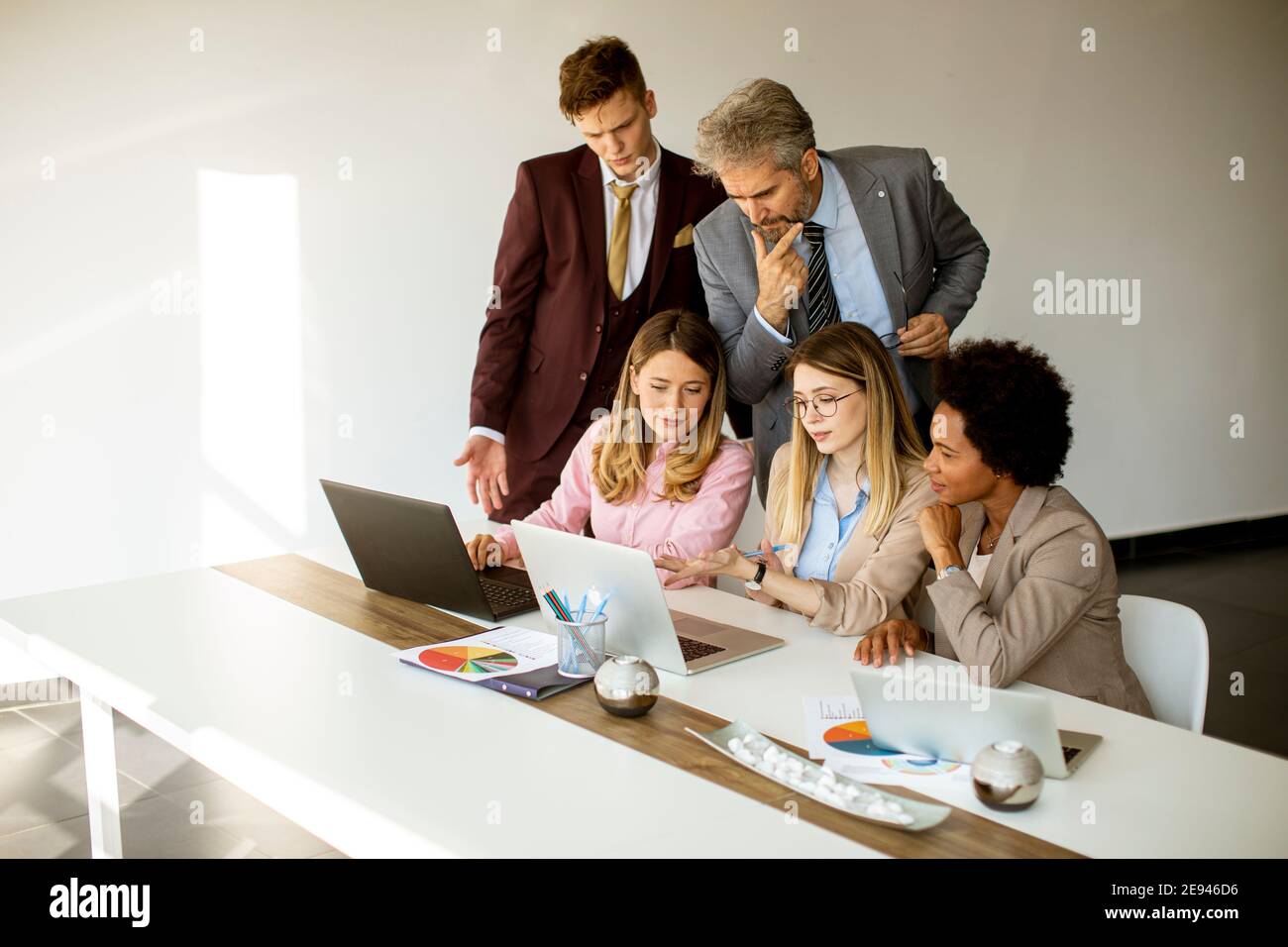 View at multiethnic group of business people working together and ...