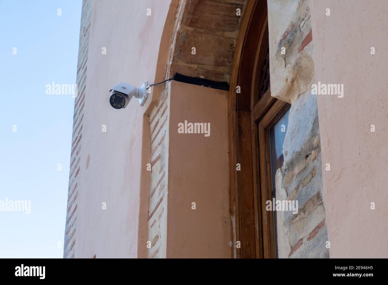 Low angle shot of a security camera on an old wall Stock Photo - Alamy
