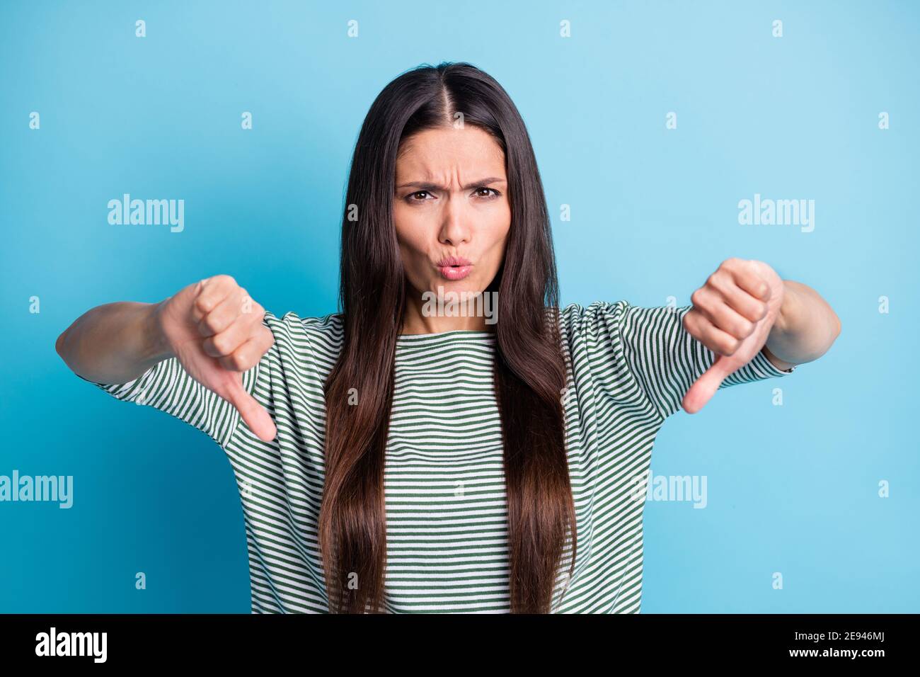 Photo of attractive unsatisfied person show two arms thumbs down sullen ...