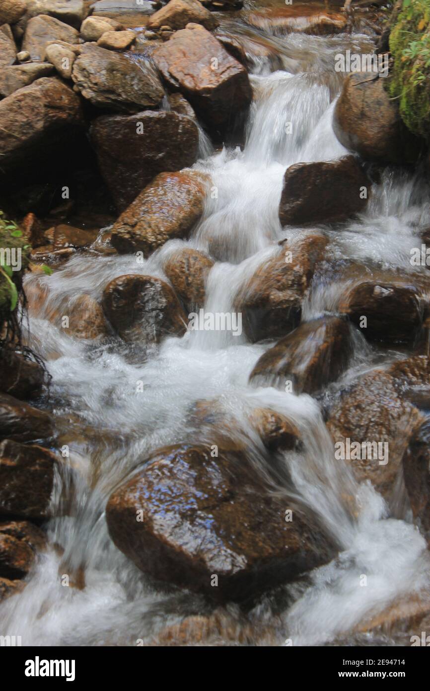 Water Cascading Over Rocks Stock Photo - Alamy