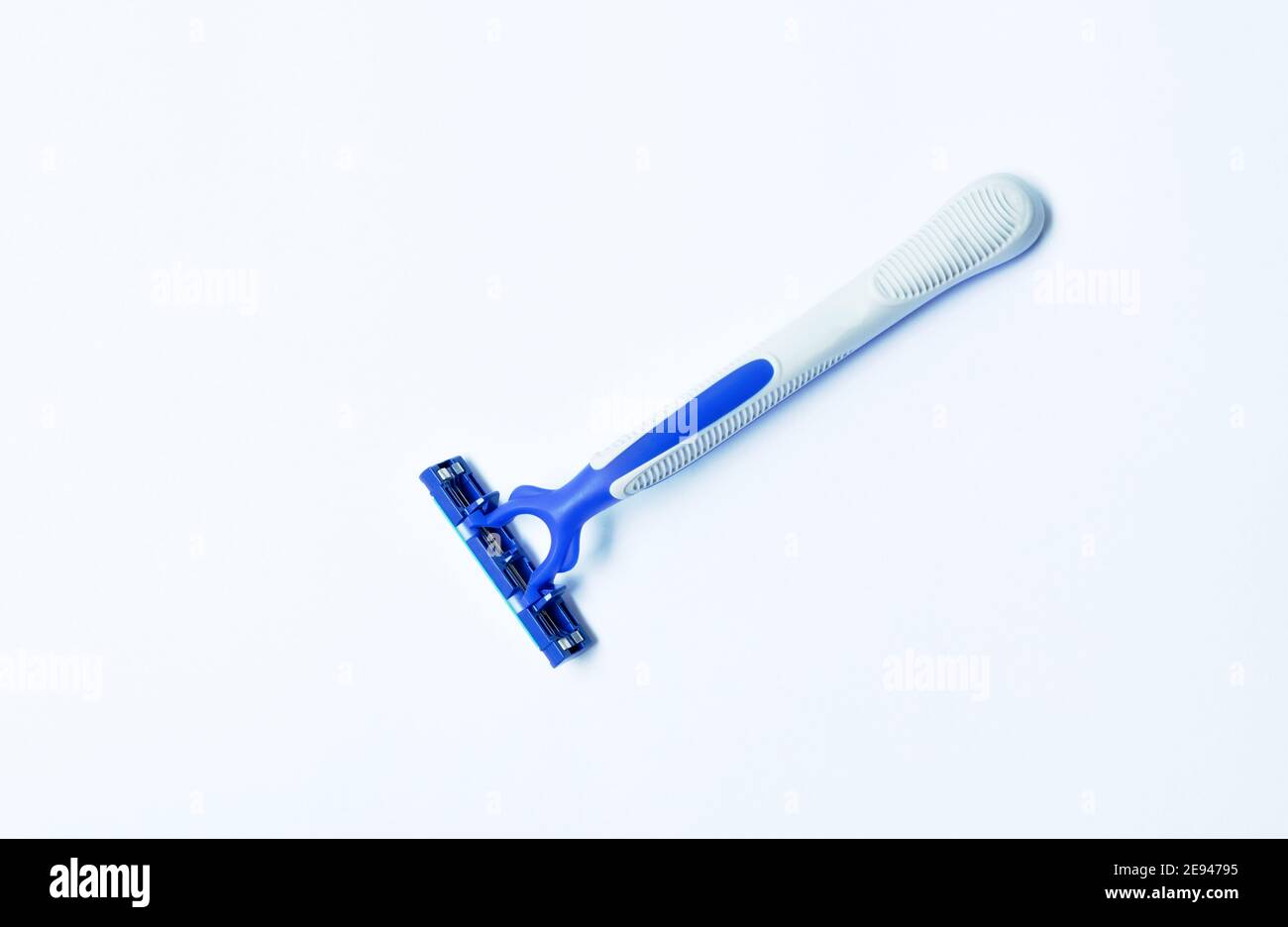 blue plastic shaver arranging on white background Stock Photo - Alamy