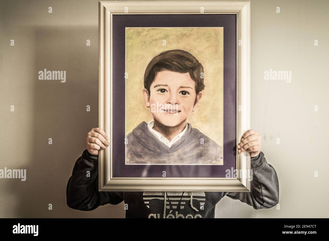 Original portrait of a boy holding his portrait oil canvas painting ...