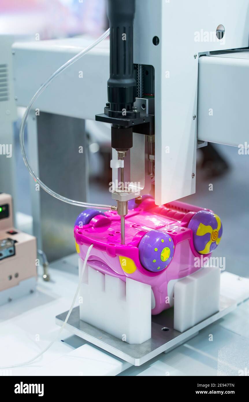 automatic robot drill machine tool at industrial manufacture toy ...