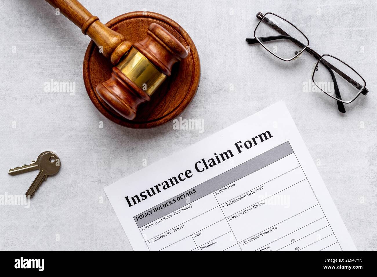 Insurance claim form with judge gavel . Top view Stock Photo - Alamy