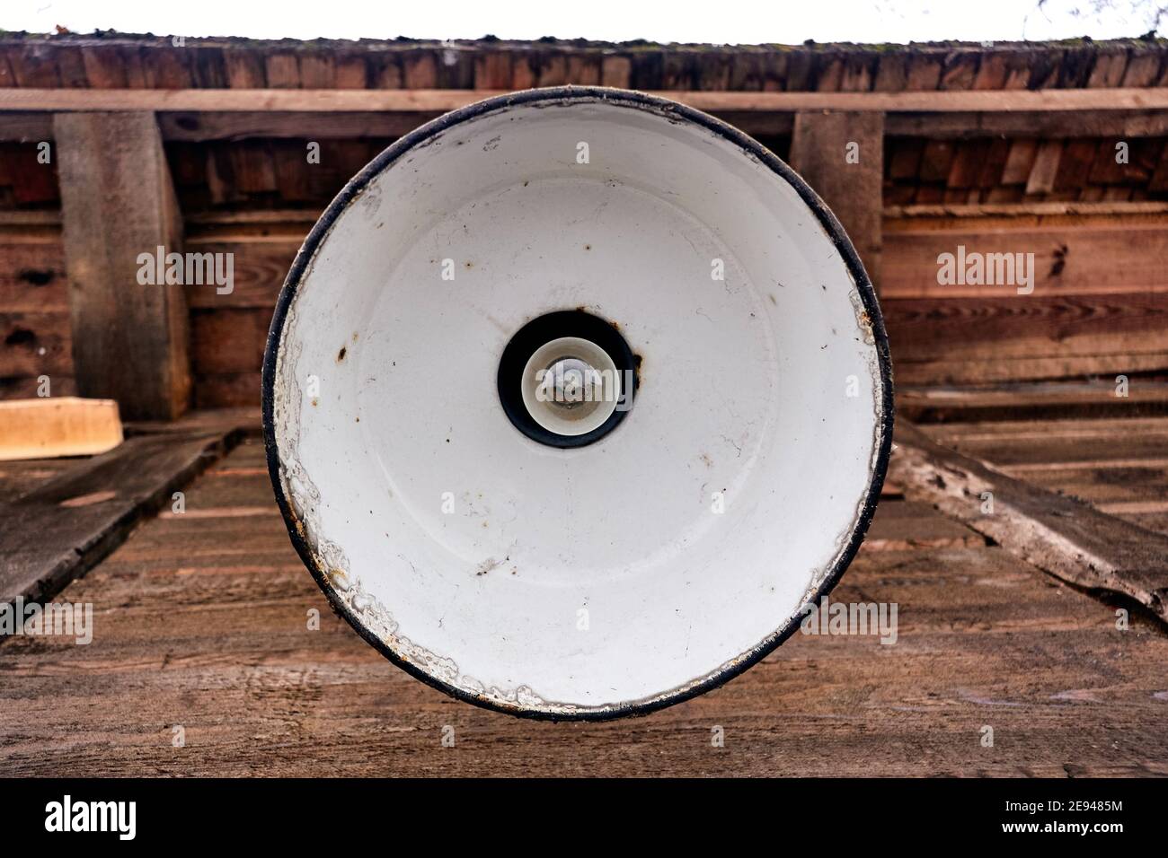 Bottom view of a lamp hanging from wooden building Stock Photo - Alamy