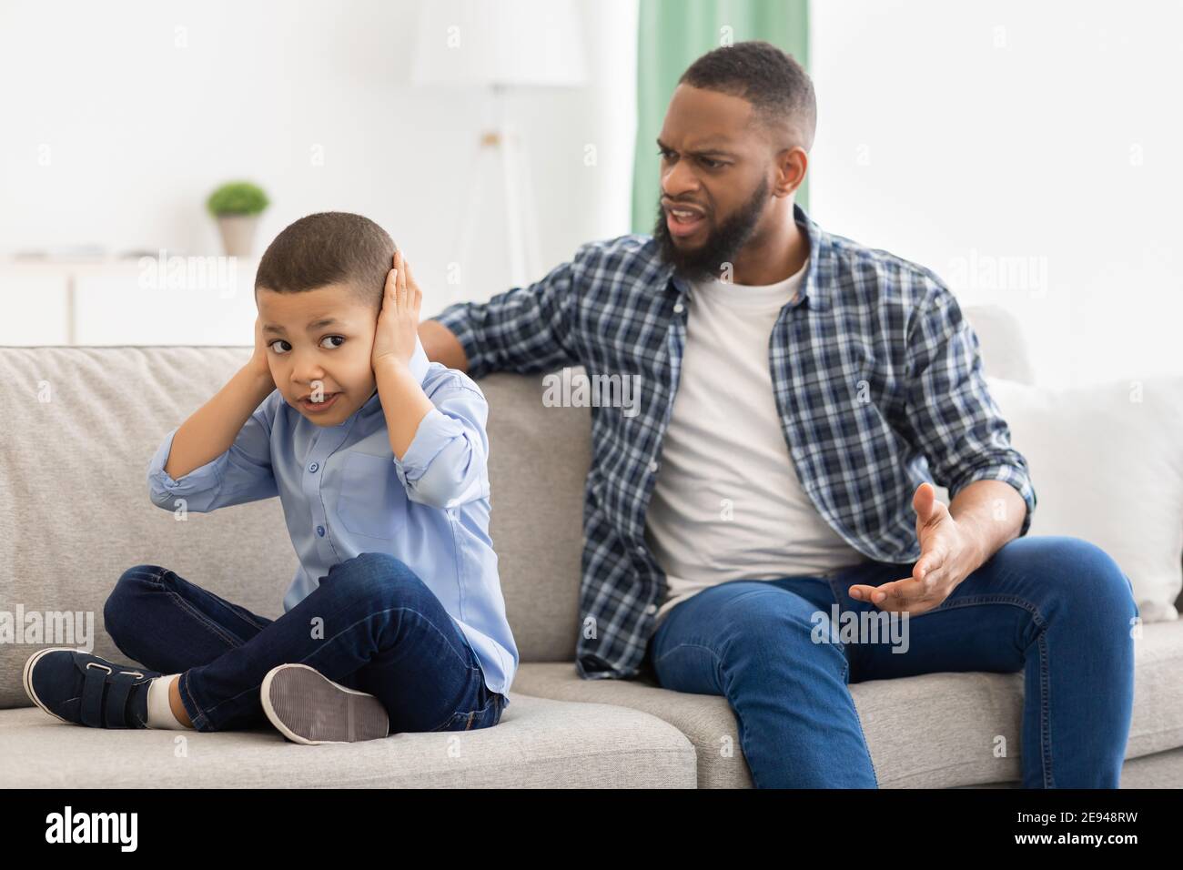 Scared child and angry father hi-res stock photography and images - Alamy