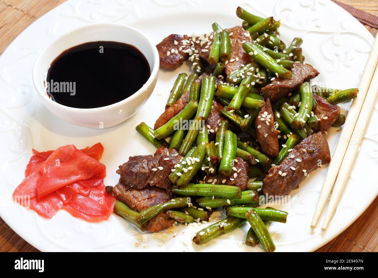 Beef with green beans and sesame seeds Stock Photo - Alamy