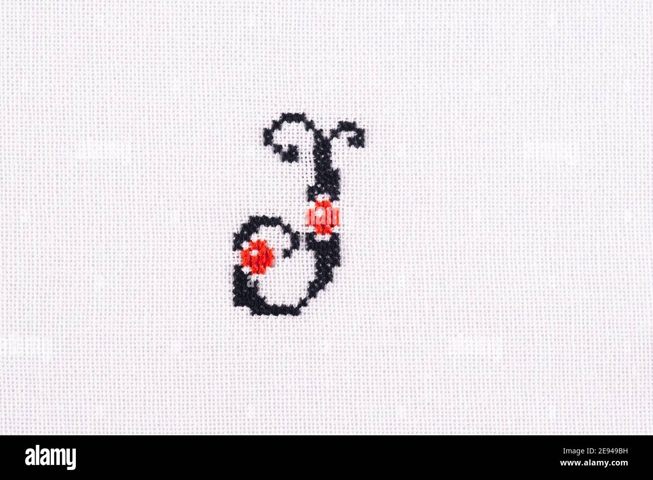 Letter J of Embroidered Cross - Stitch Latin Alphabet on White Linen ...