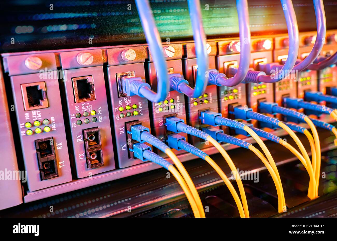 Fiber Optical cables connected to an optic ports and Network cables ...