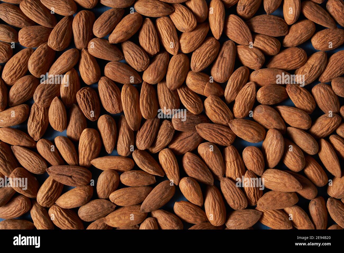 Fresh raw almonds background lay flat shot Stock Photo - Alamy