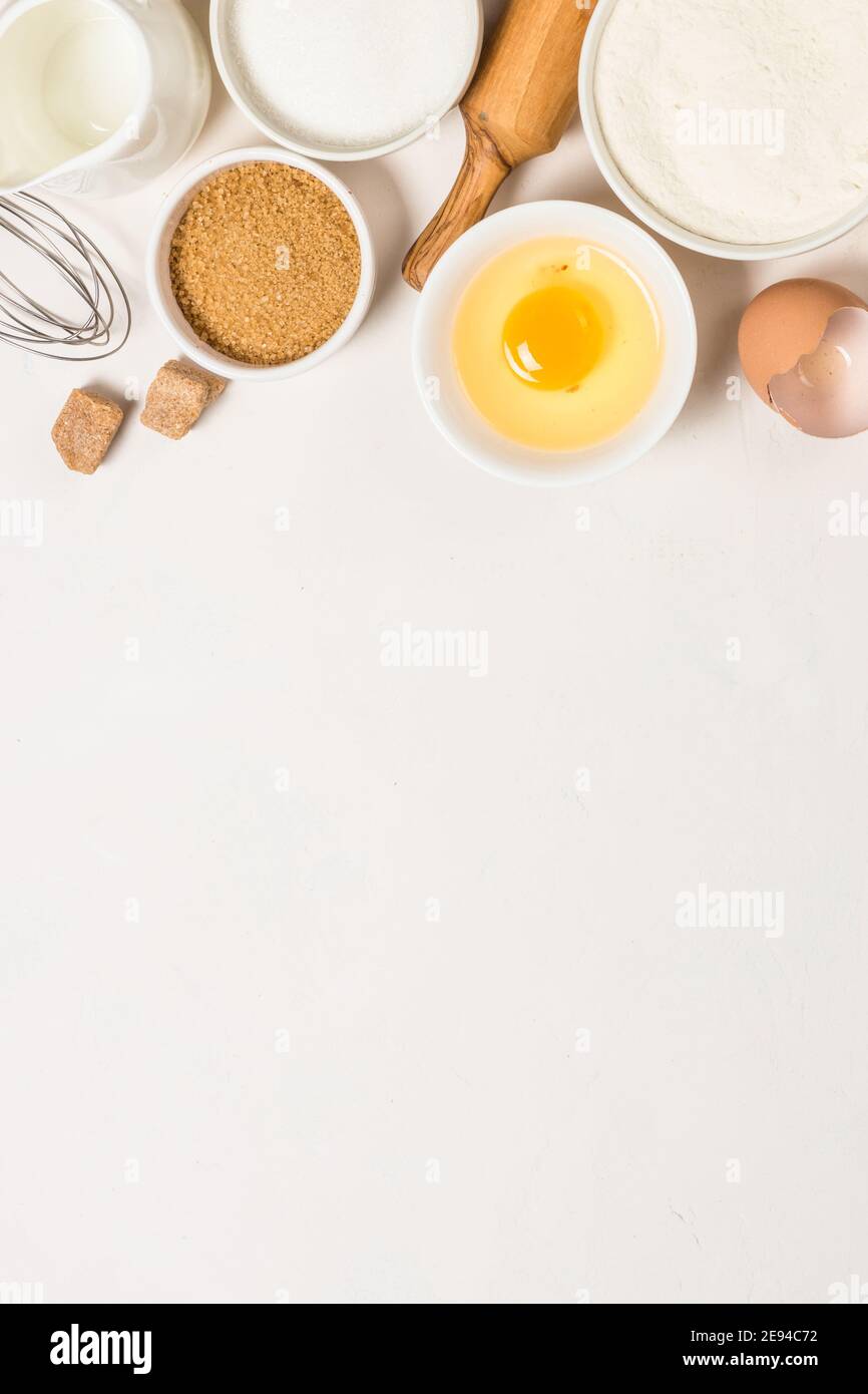 Baking ingredients at blue table top view Stock Photo - Alamy