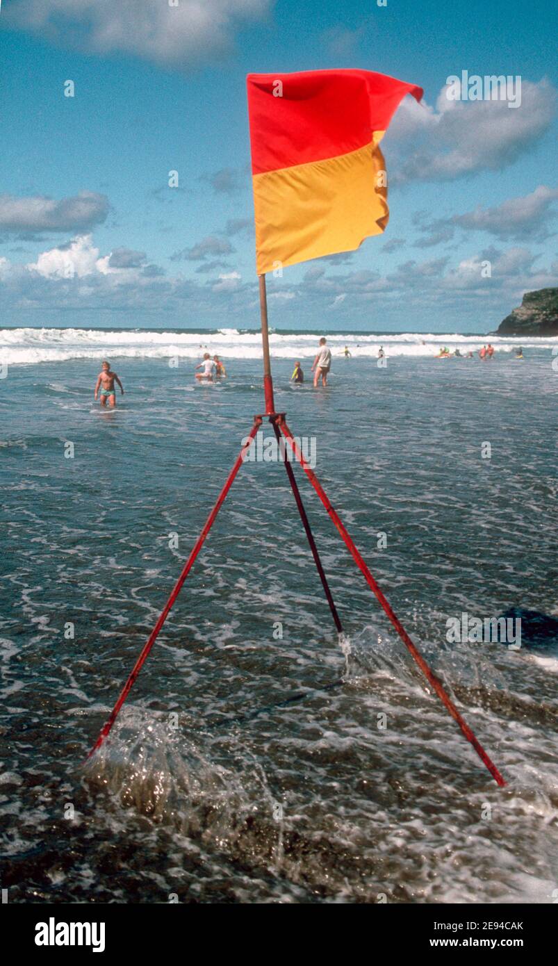 A warning flag for bathers on a beach in Cornwall Stock Photo - Alamy