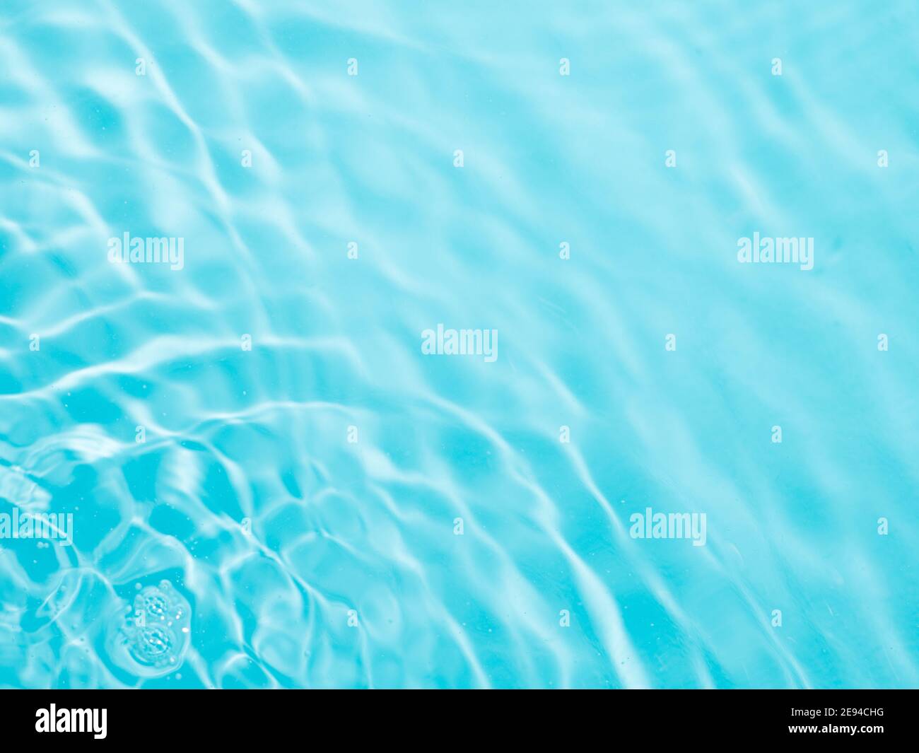 Ripple water texture on blue pool background. Shadow of water on ...