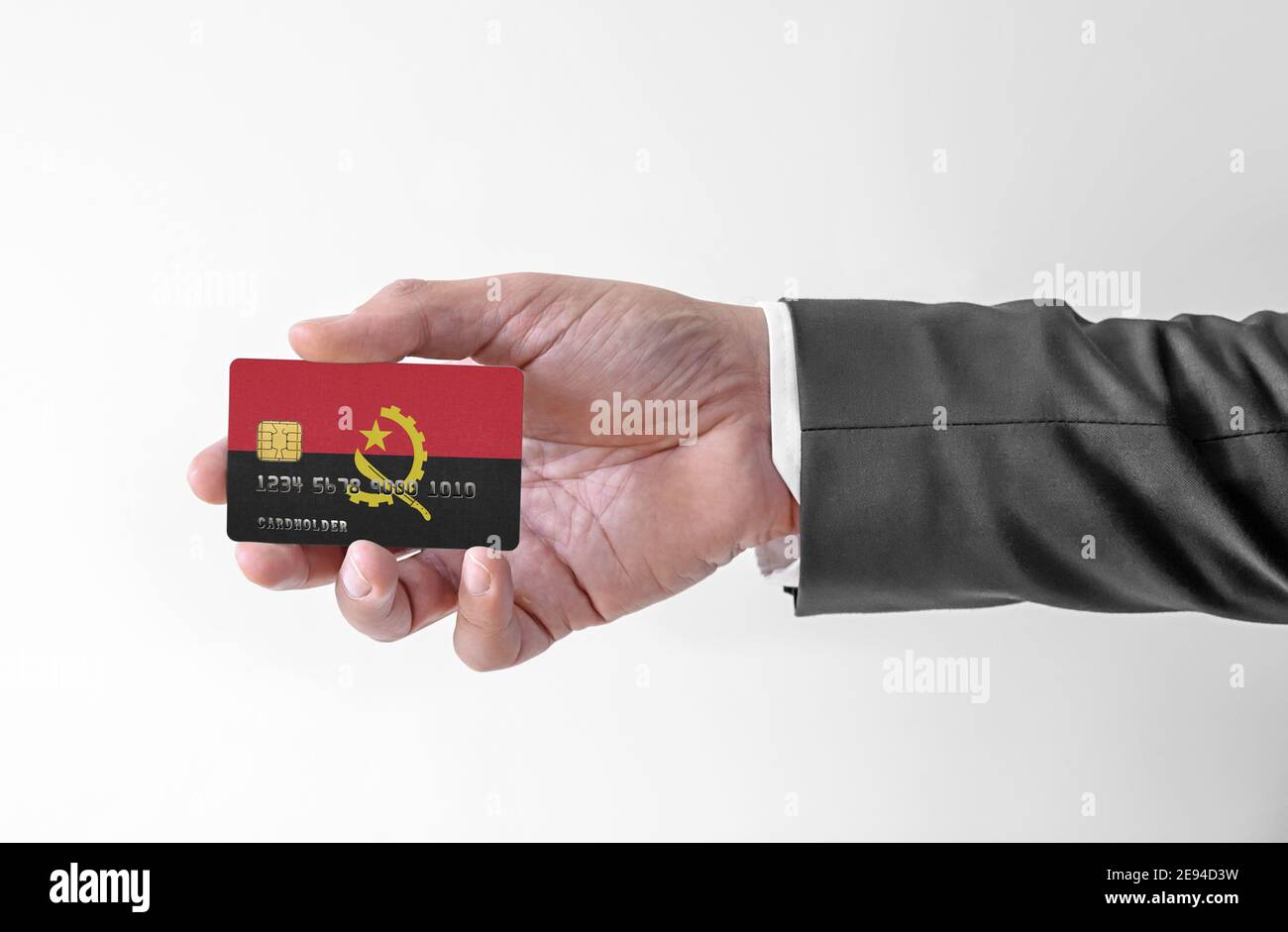 Bank credit plastic card with flag of Angola holding man in elegant ...