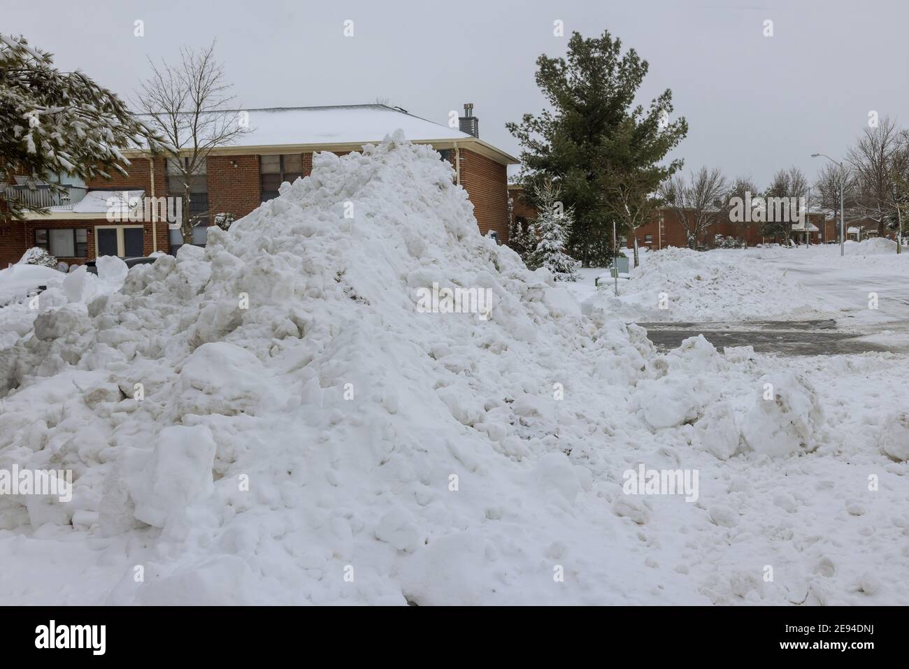 A pile snow with removed of after a very heavy snowfall Stock Photo - Alamy