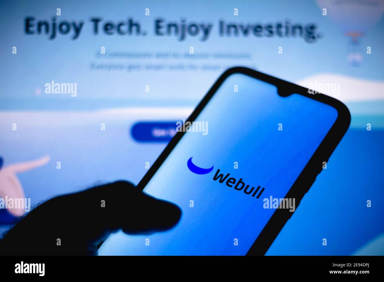 In this photo illustration the Webull Financial, logo seen displayed on ...