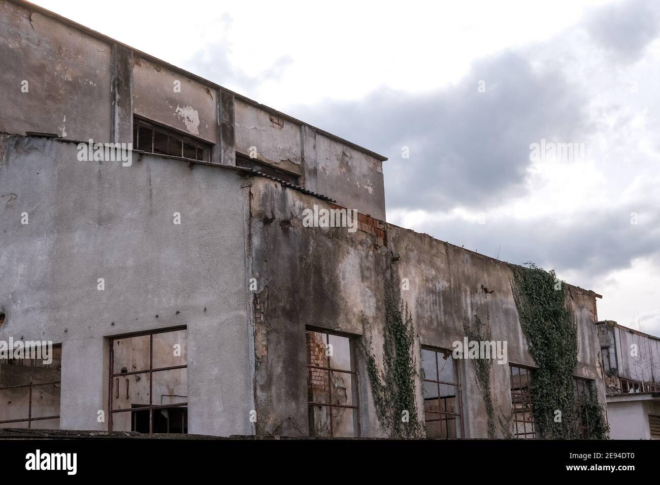 abandoned factory warehouse with broken windows Stock Photo - Alamy