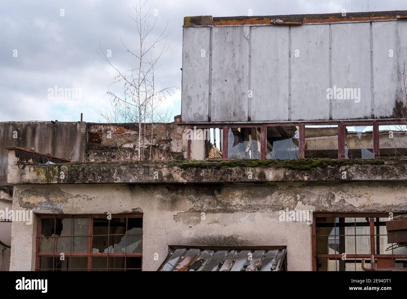abandoned factory warehouse with broken windows Stock Photo - Alamy
