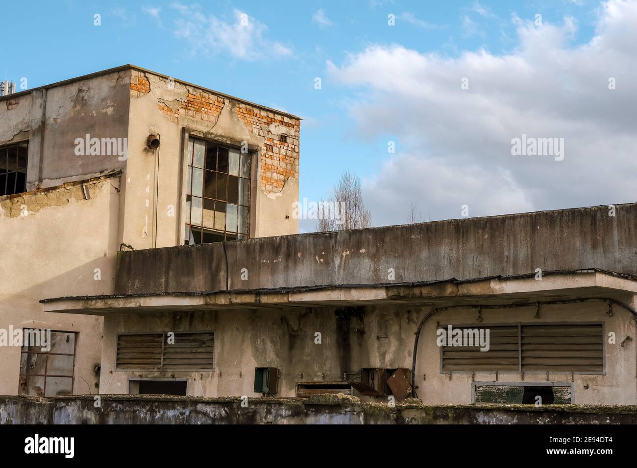 abandoned factory warehouse with broken windows Stock Photo - Alamy