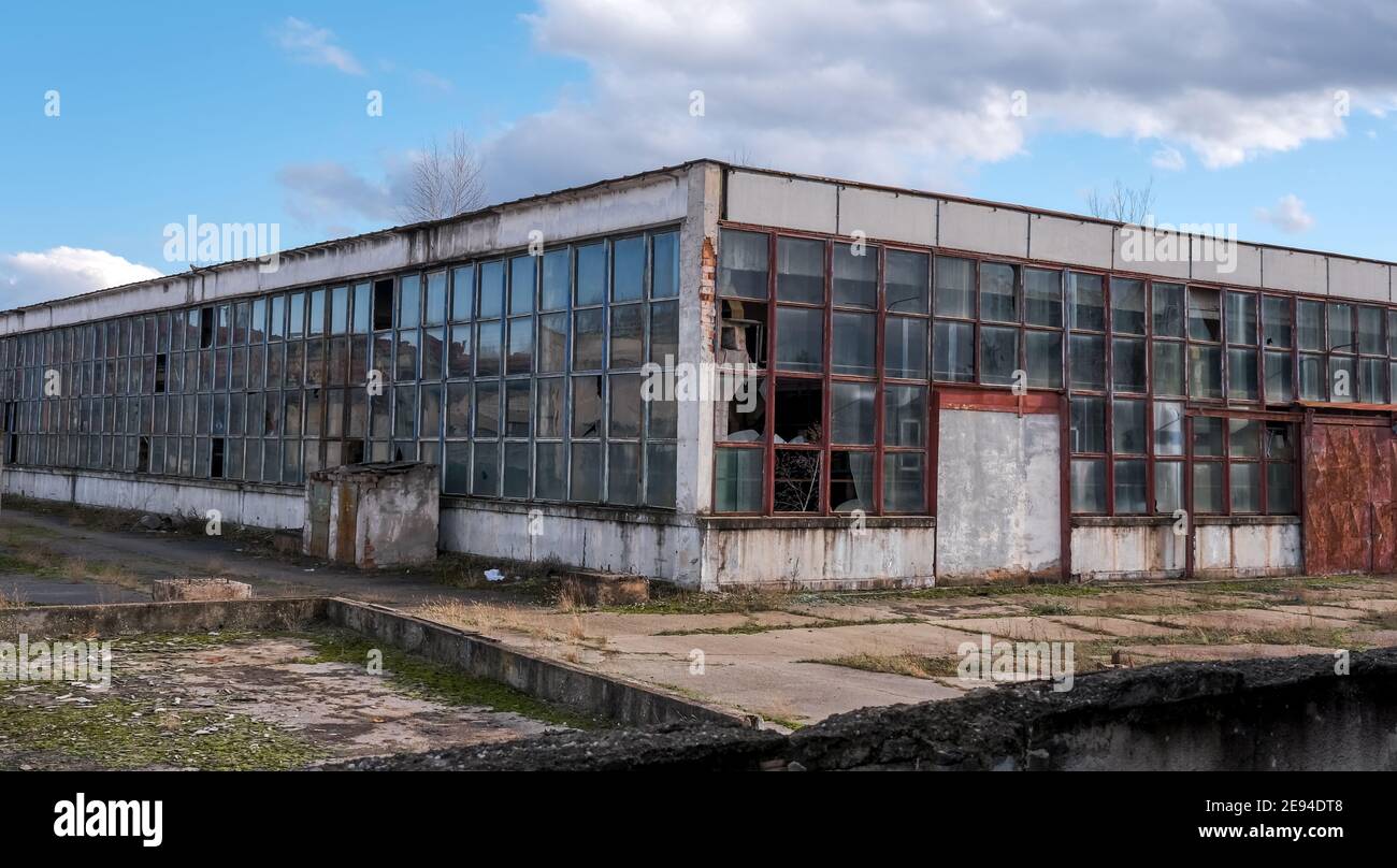 abandoned factory warehouse with broken windows Stock Photo - Alamy