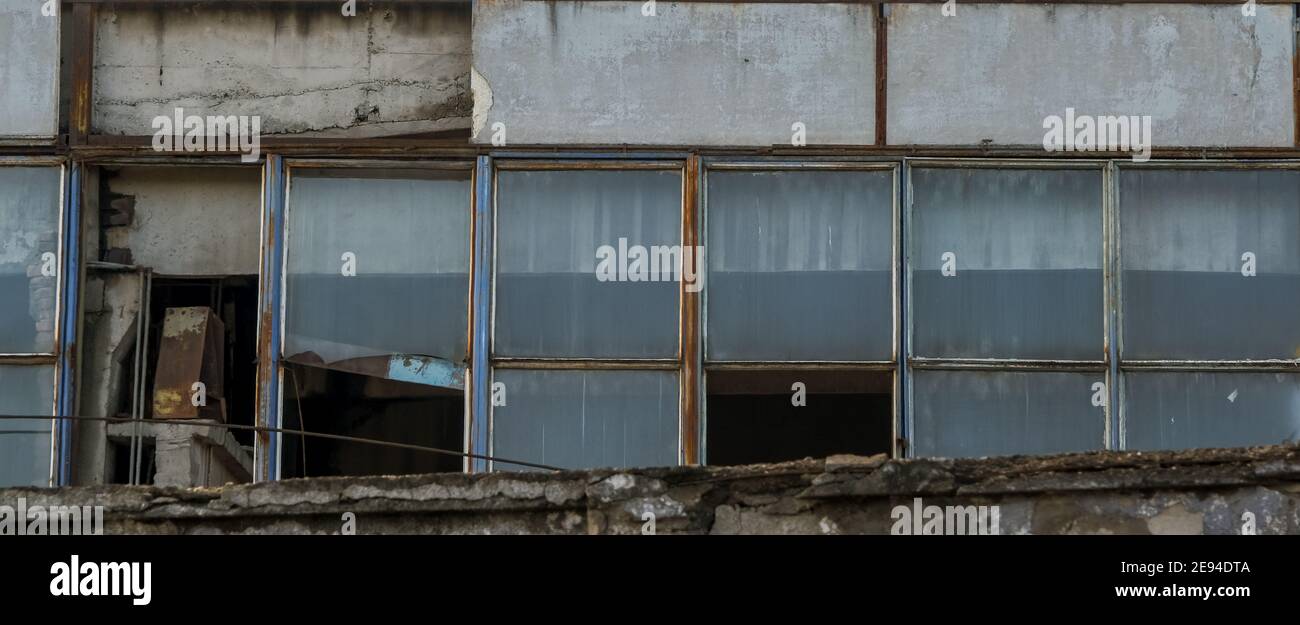 abandoned factory warehouse with broken windows Stock Photo - Alamy