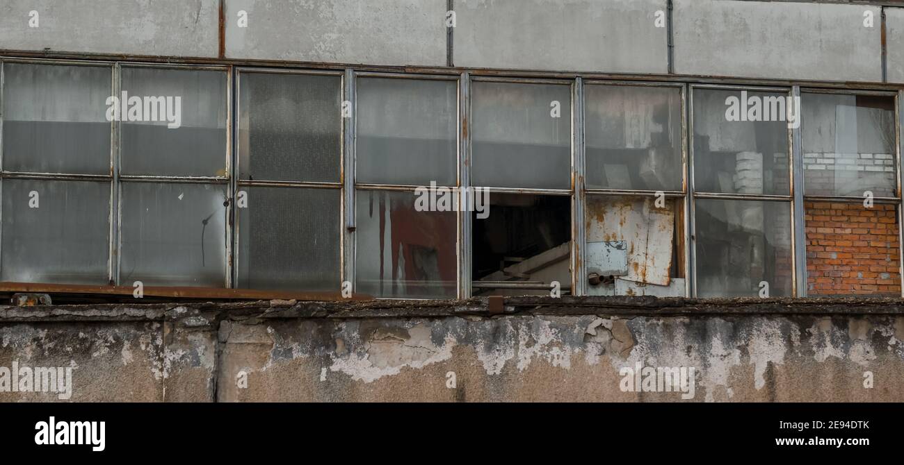 abandoned factory warehouse with broken windows Stock Photo - Alamy