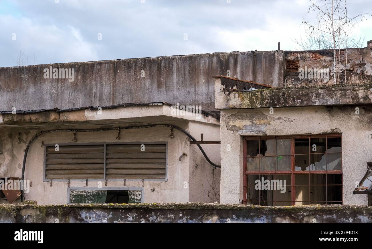 abandoned factory warehouse with broken windows Stock Photo - Alamy