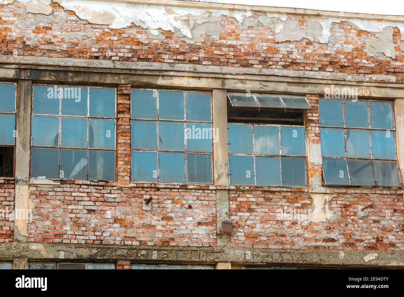 abandoned factory warehouse with broken windows Stock Photo - Alamy