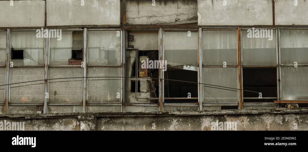 abandoned factory warehouse with broken windows Stock Photo - Alamy